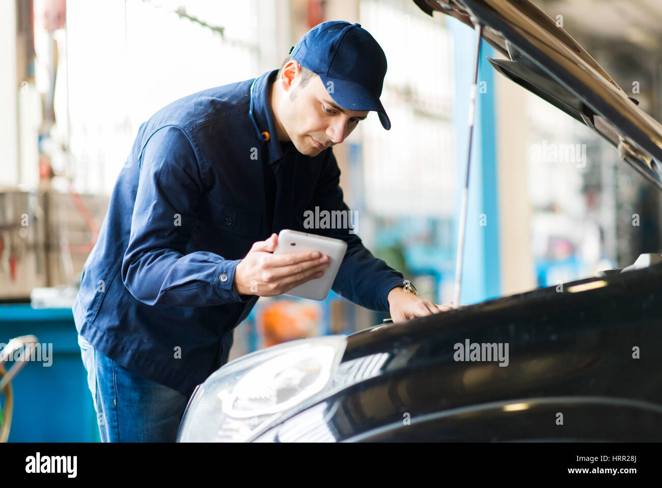 Mechanic using tablet in hi-res stock photography and images - Alamy