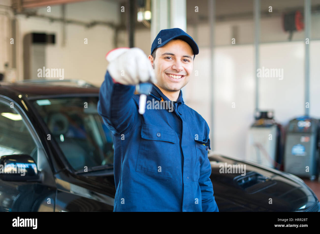 Mechanic giving car key man hi-res stock photography and images - Alamy