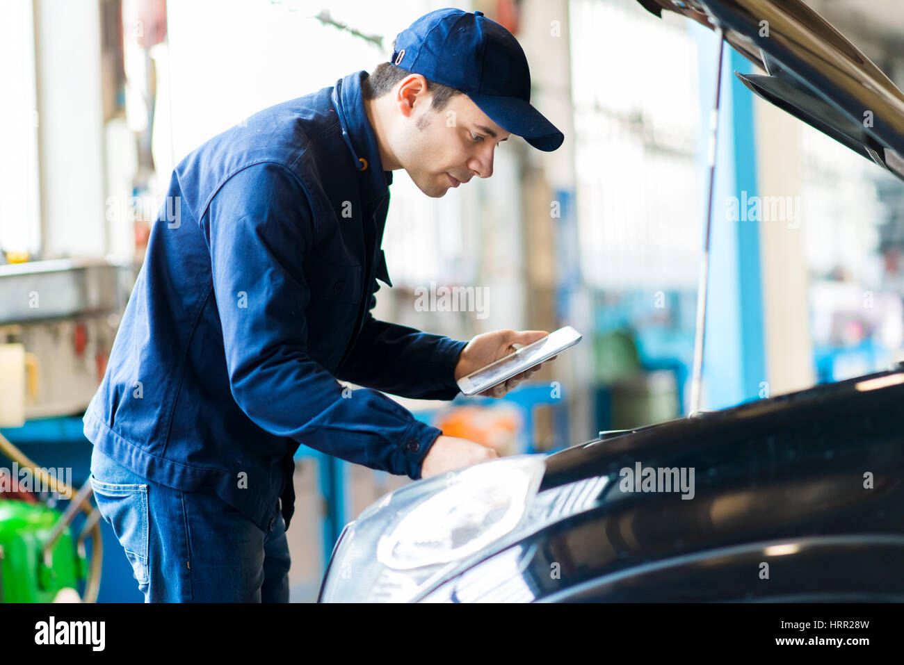 Mechanic using tablet in hi-res stock photography and images - Alamy