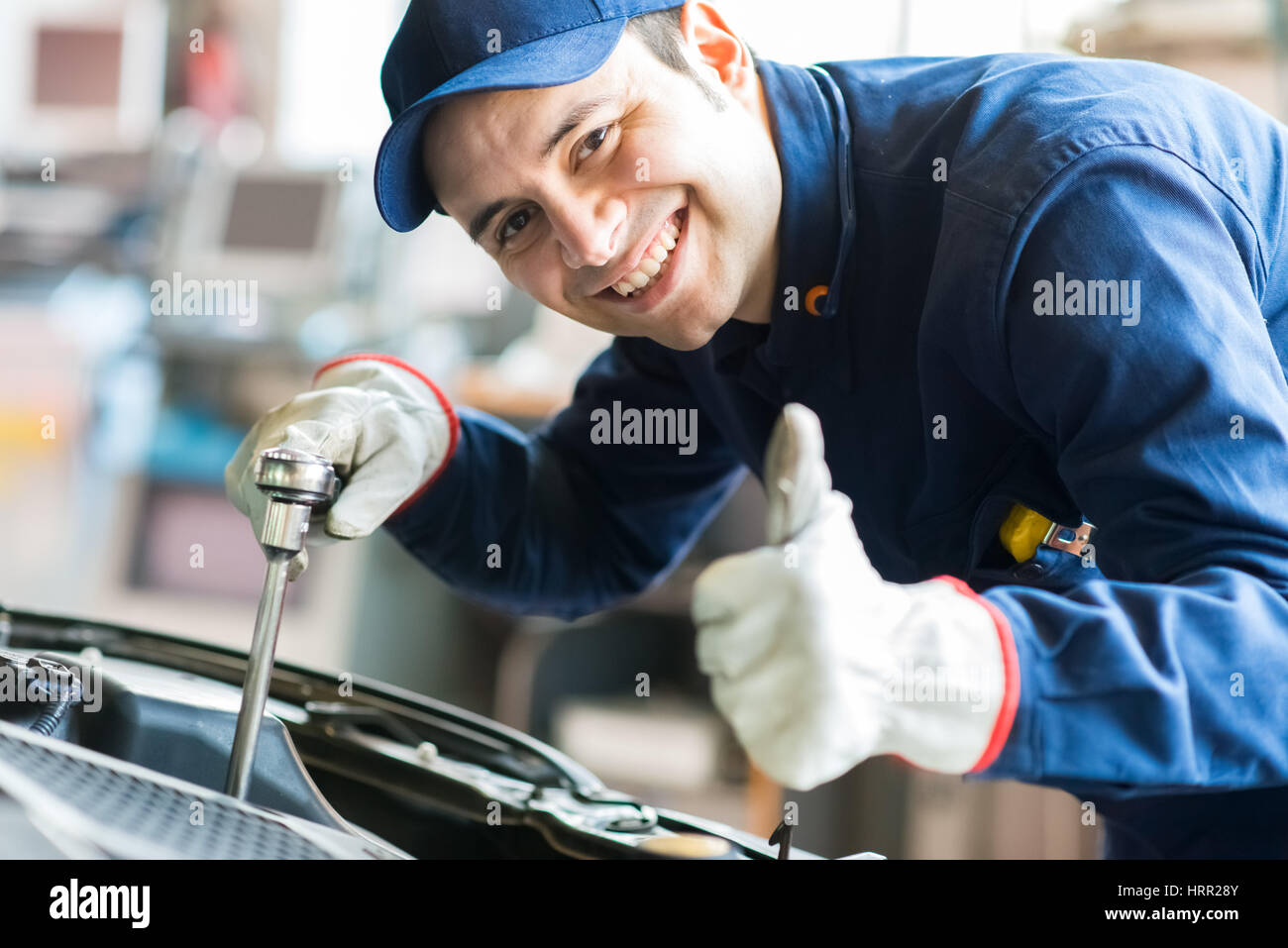 Mechanic repairing a car Stock Photo - Alamy