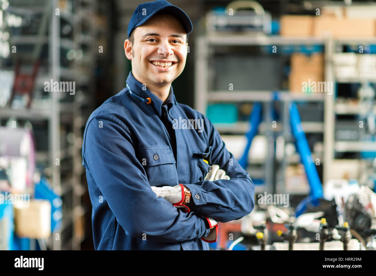 Portrait of a mechanic in his garage Stock Photo - Alamy