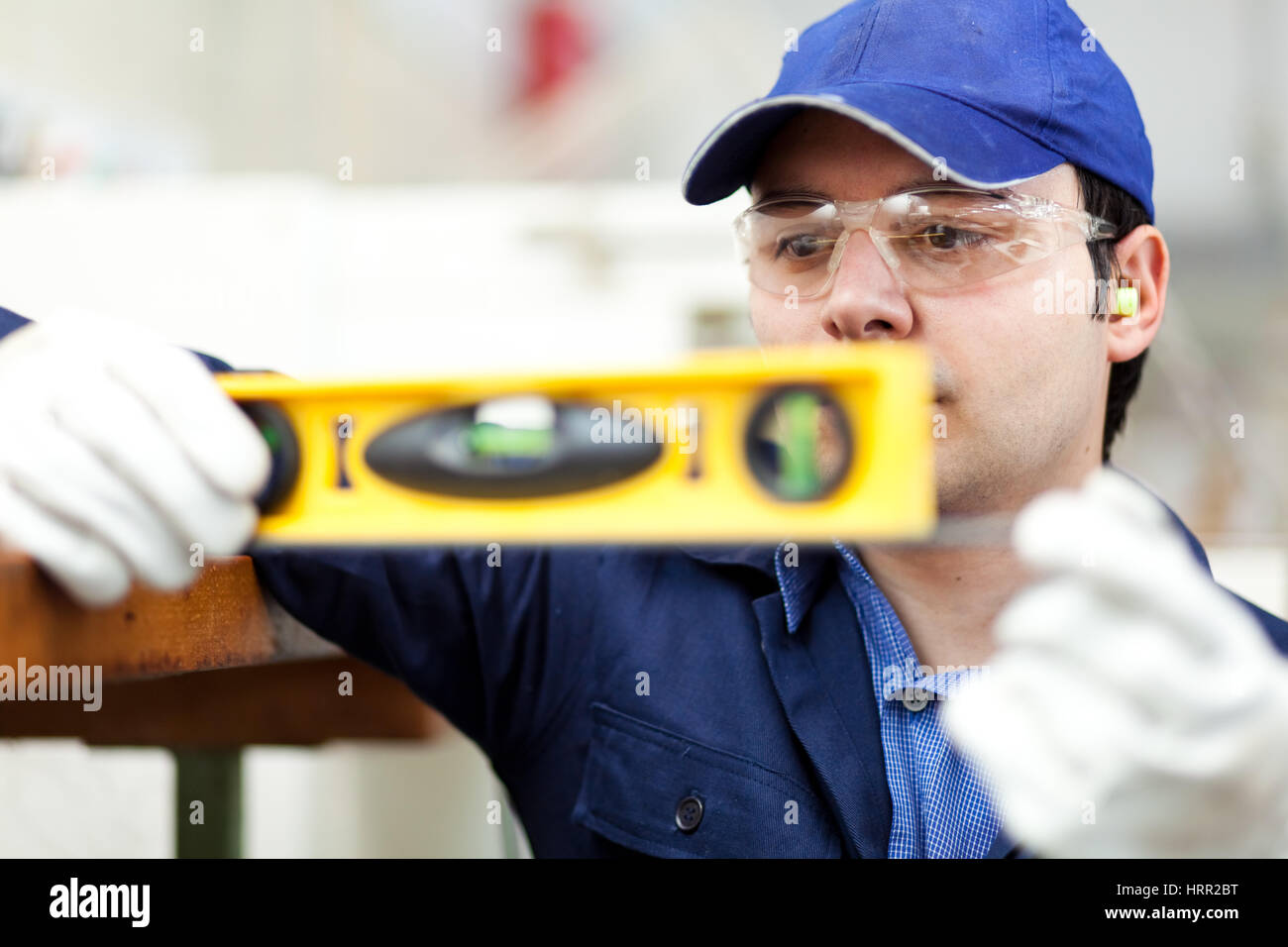 Worker using a level Stock Photo - Alamy
