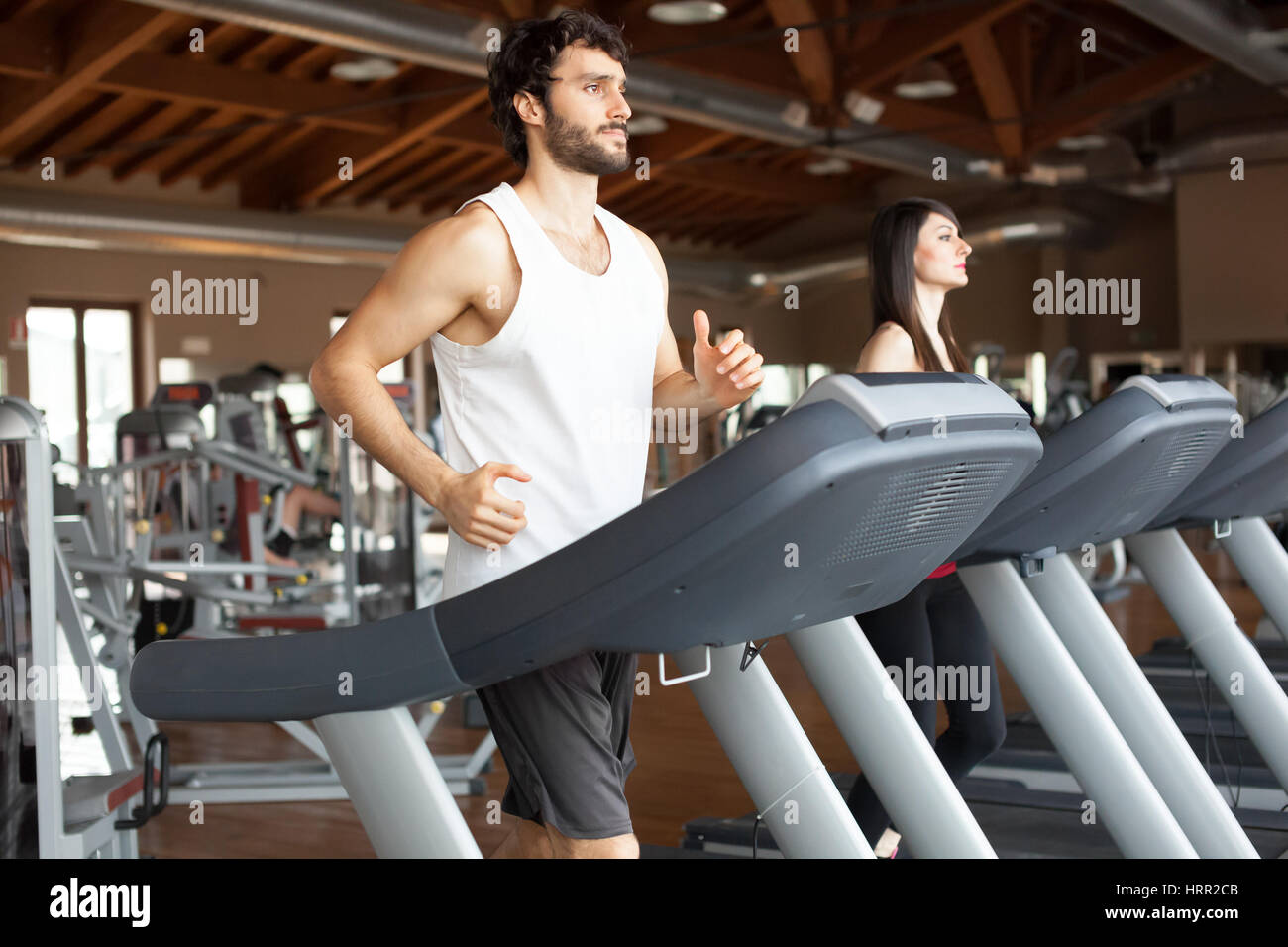 Group of people running on treadmills Stock Photo - Alamy