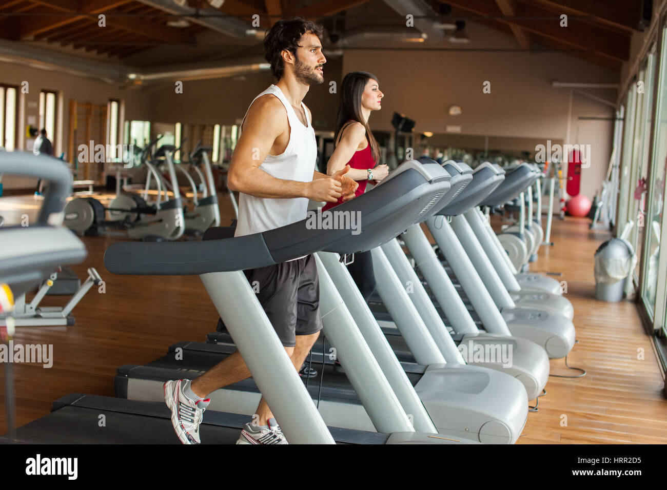 Group of people running on treadmills Stock Photo - Alamy