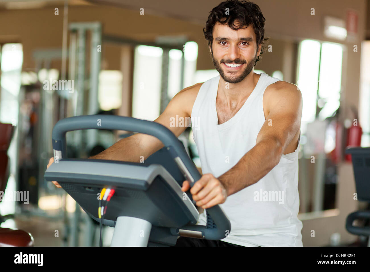 Man working out on a treadmill in a gym Stock Photo - Alamy