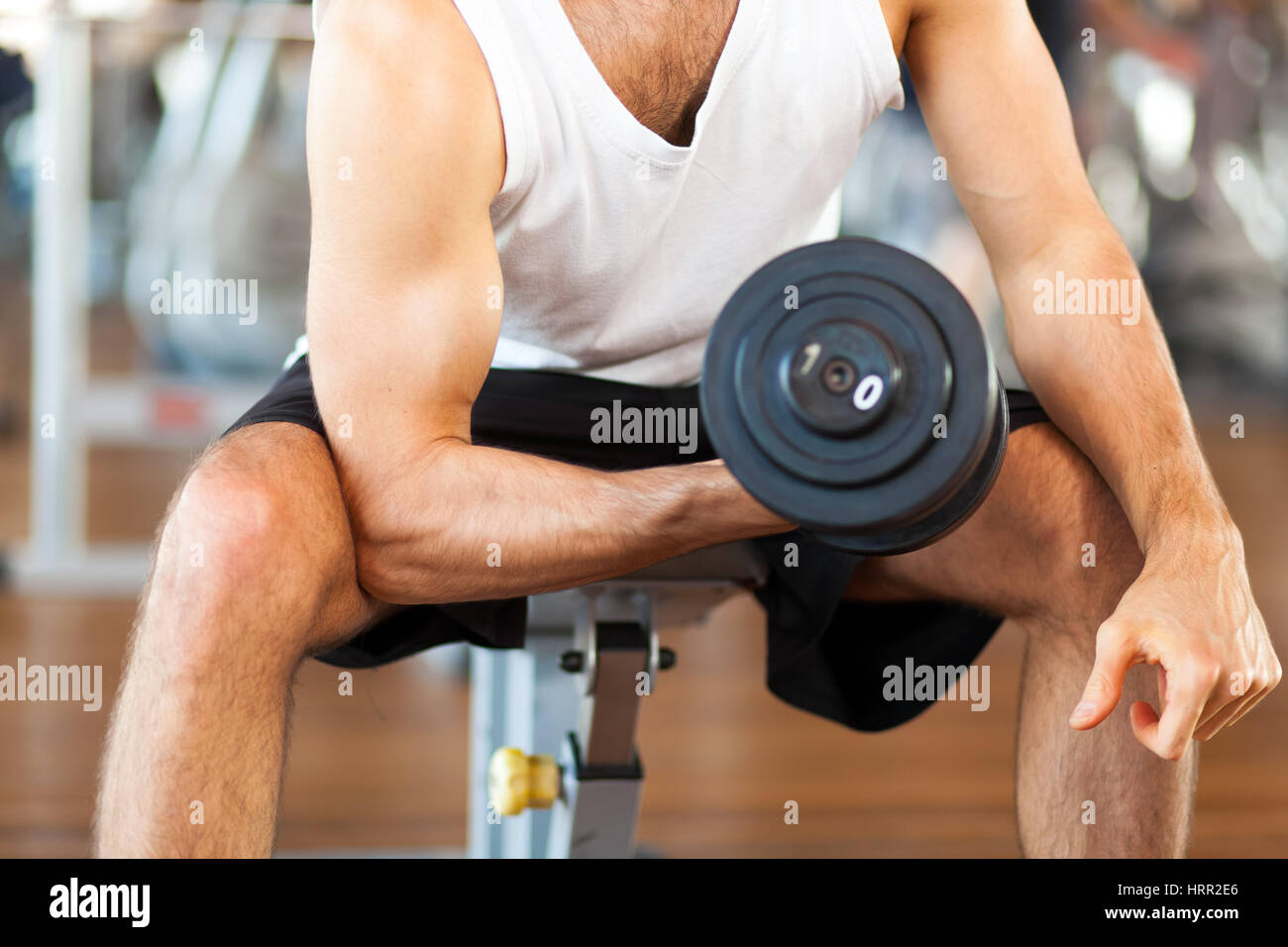 Man lifting weights Stock Photo - Alamy