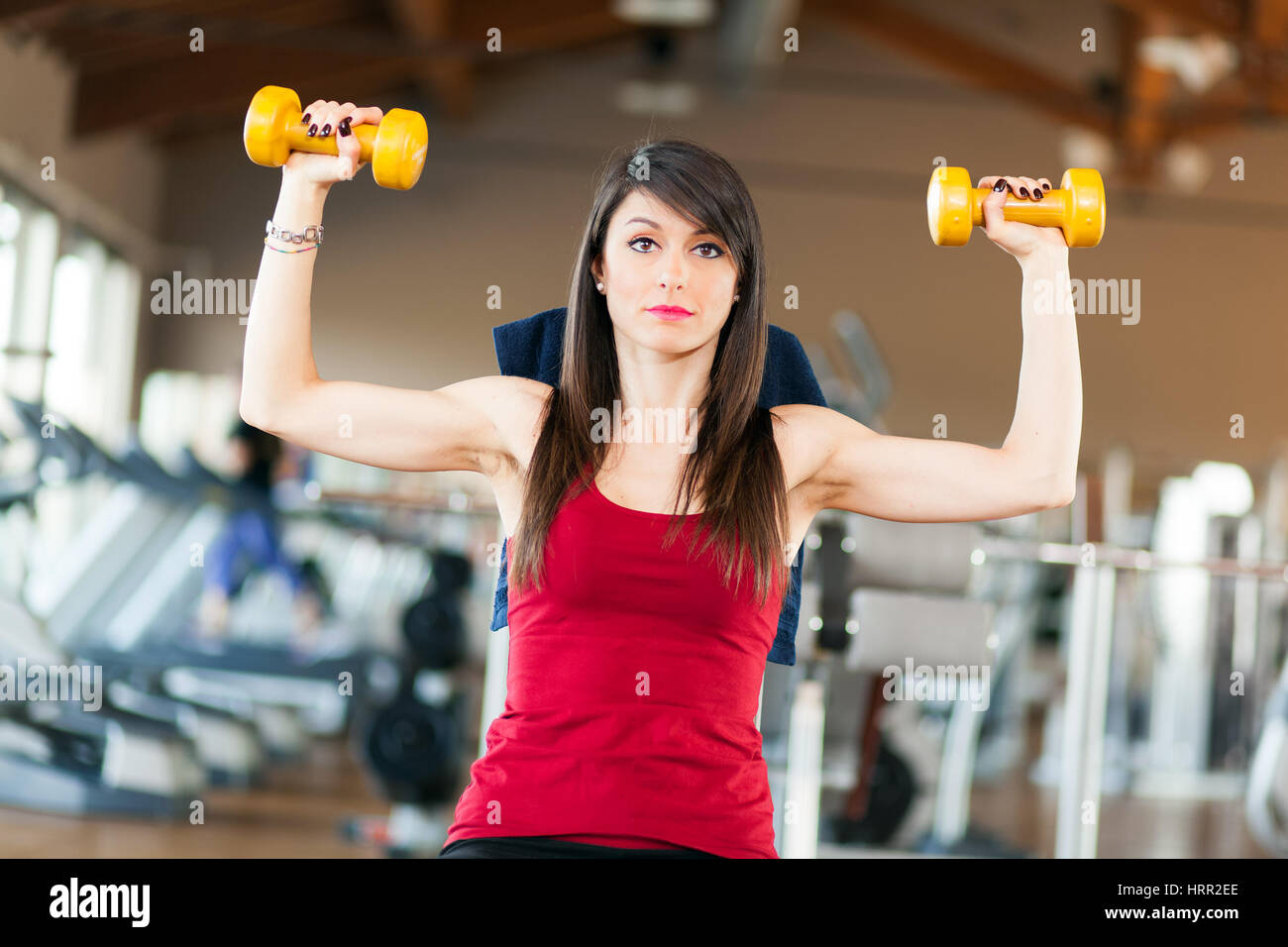 Woman working out in a gym Stock Photo - Alamy