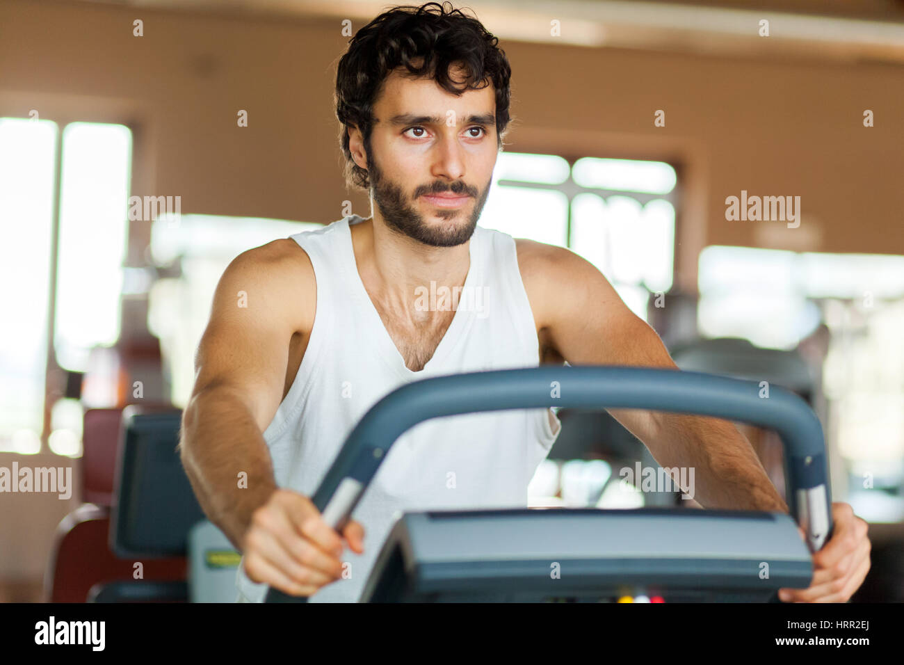 Man working out on a treadmill in a gym Stock Photo - Alamy