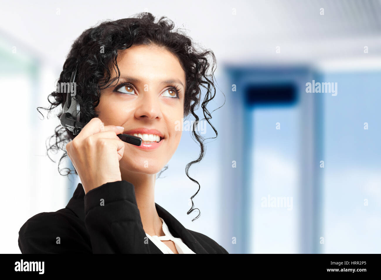 Portrait of a beautiful female call center operator Stock Photo - Alamy