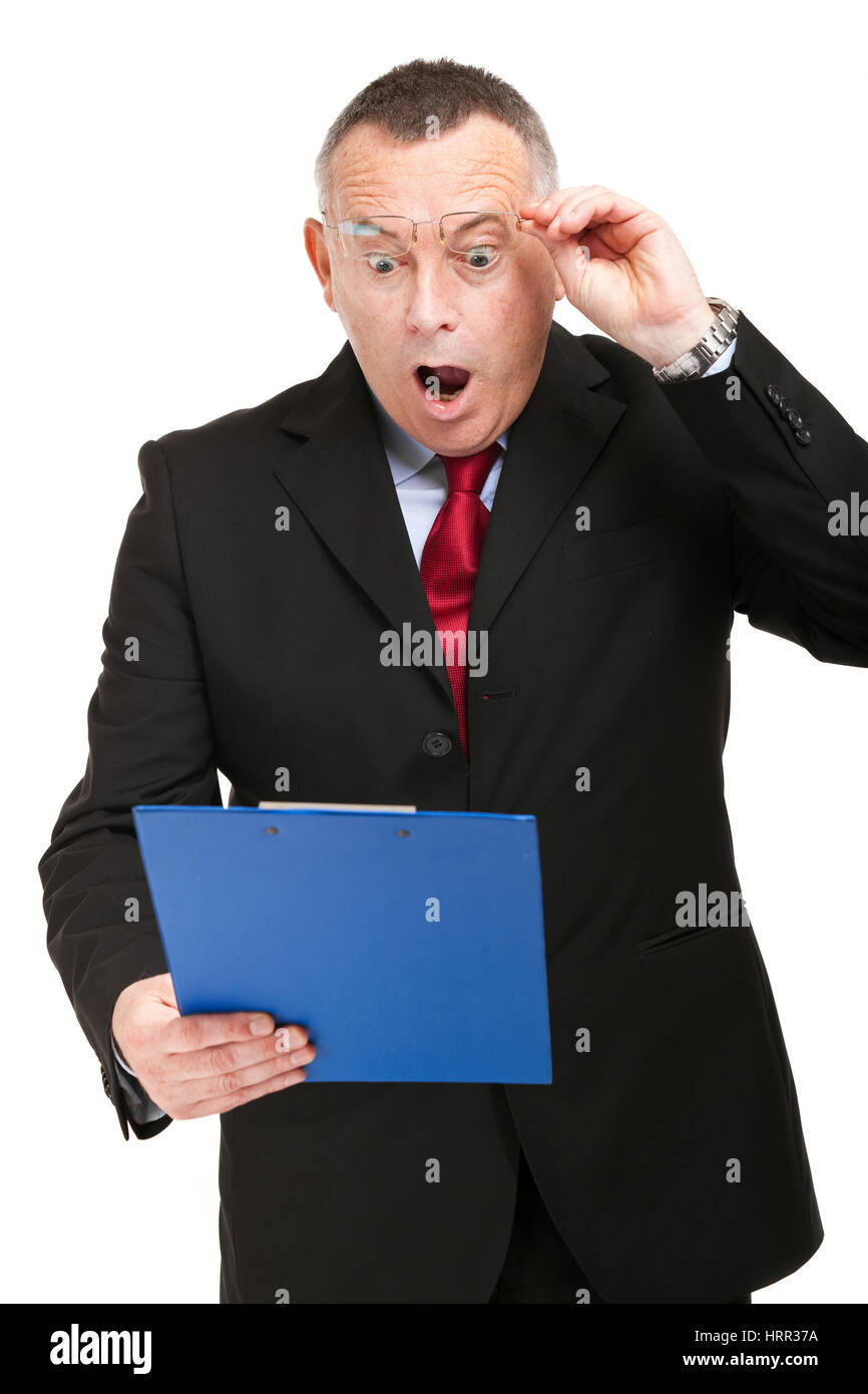 Surprised mature businessman reading some documents Stock Photo - Alamy