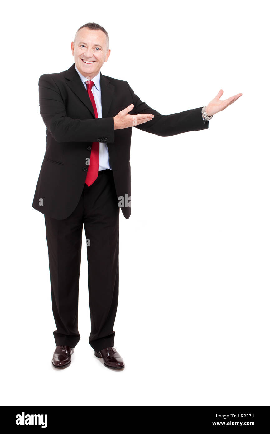 Mature male manager welcoming you Stock Photo - Alamy