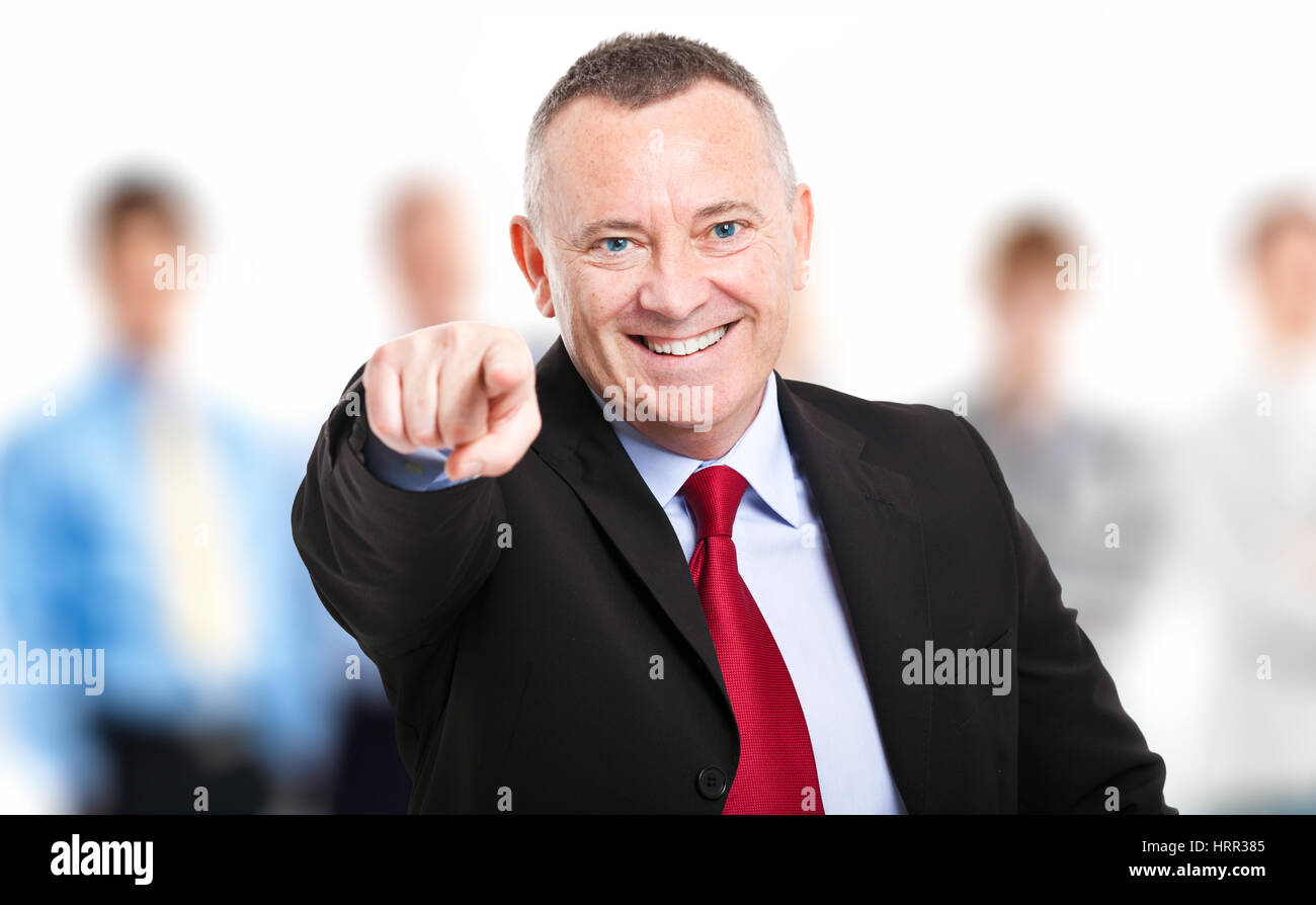 Elder businessman pointing at you Stock Photo - Alamy