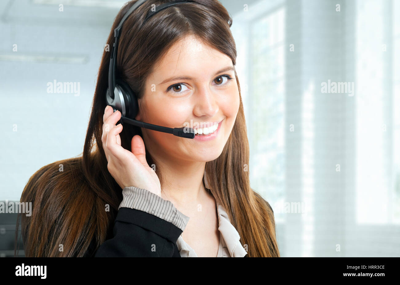 Portrait of a beautiful female operator with headset Stock Photo - Alamy