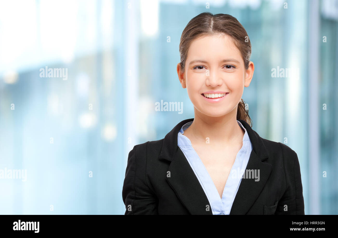Smiling young female manager Stock Photo - Alamy