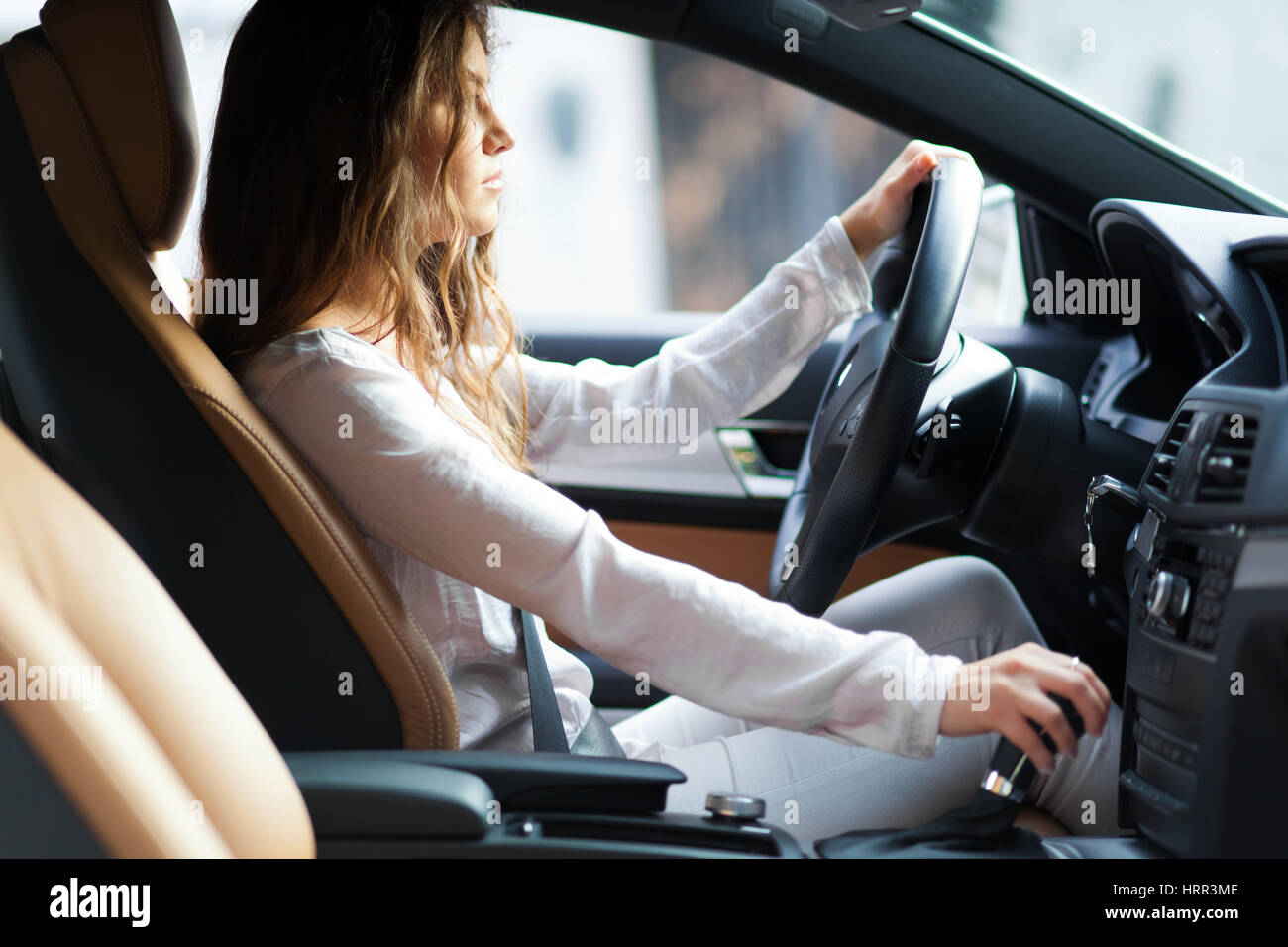 Woman driving her car Stock Photo - Alamy