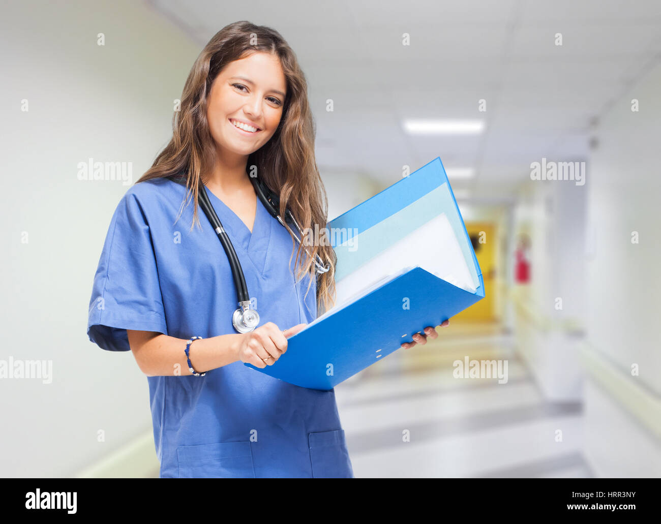 Nurse reading some documents Stock Photo - Alamy