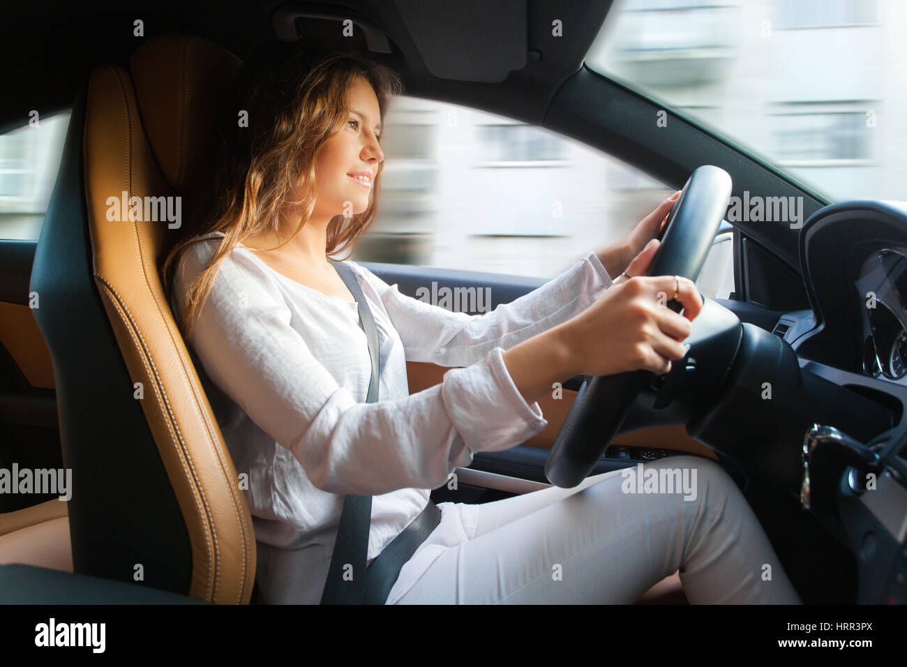 Young woman driving her car Stock Photo - Alamy