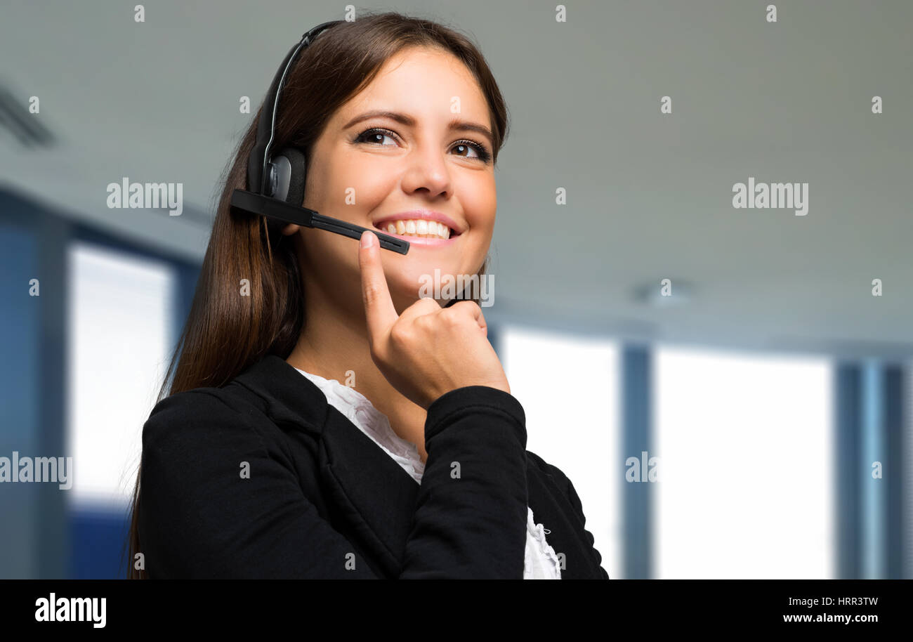 Portrait of a beautiful woman wearing headset Stock Photo - Alamy