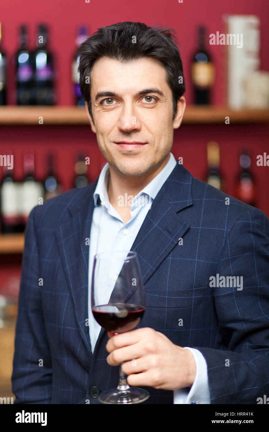Man tasting red wine in a tavern Stock Photo - Alamy