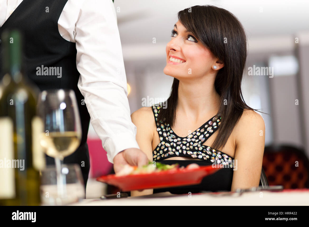 Waiter serving food in a luxury restaurant Stock Photo - Alamy