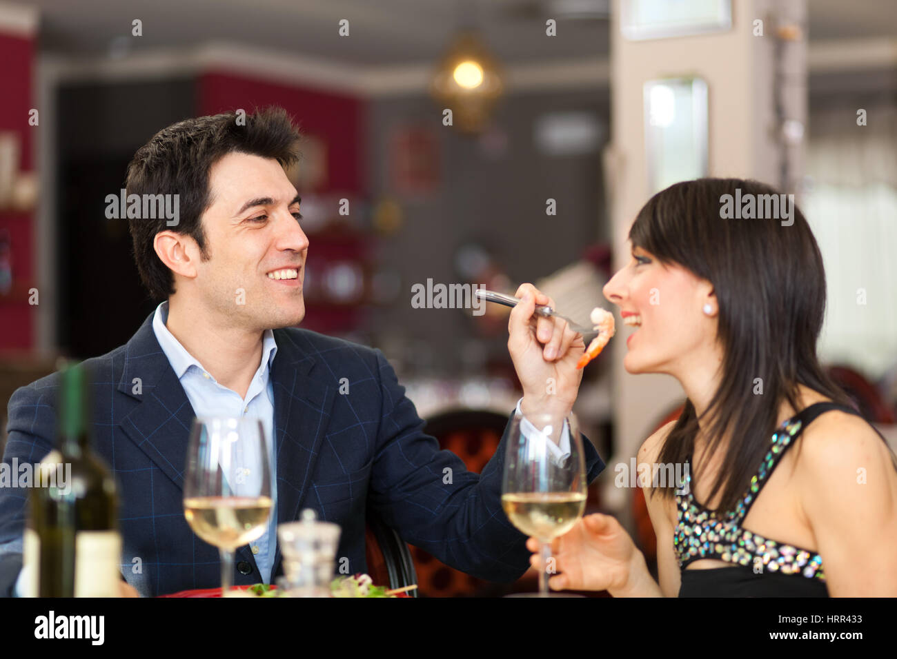 Couple having a romantic dinner in a restaurant Stock Photo - Alamy