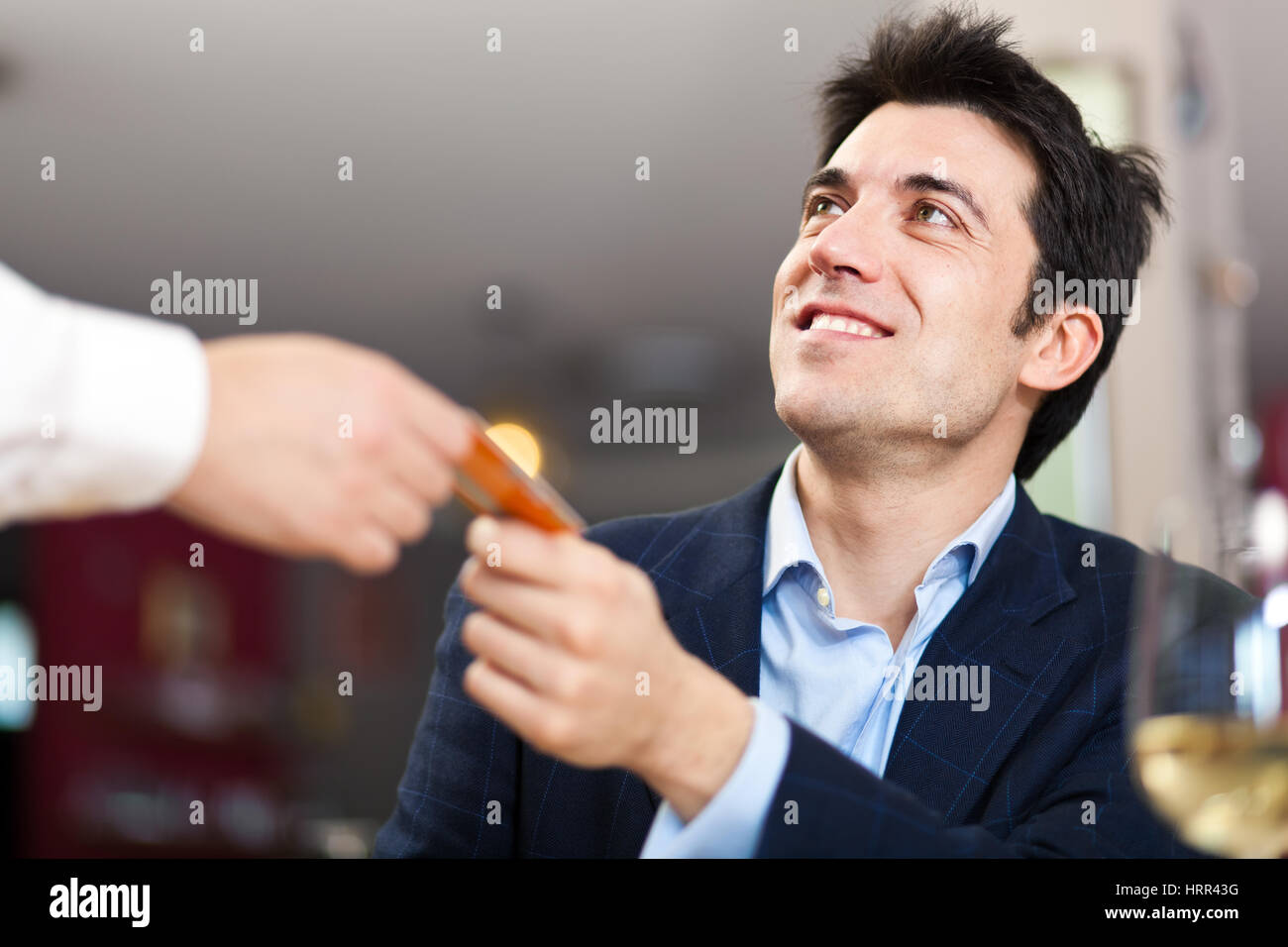 Customer paying bill at the restaurant with his credit card Stock Photo ...