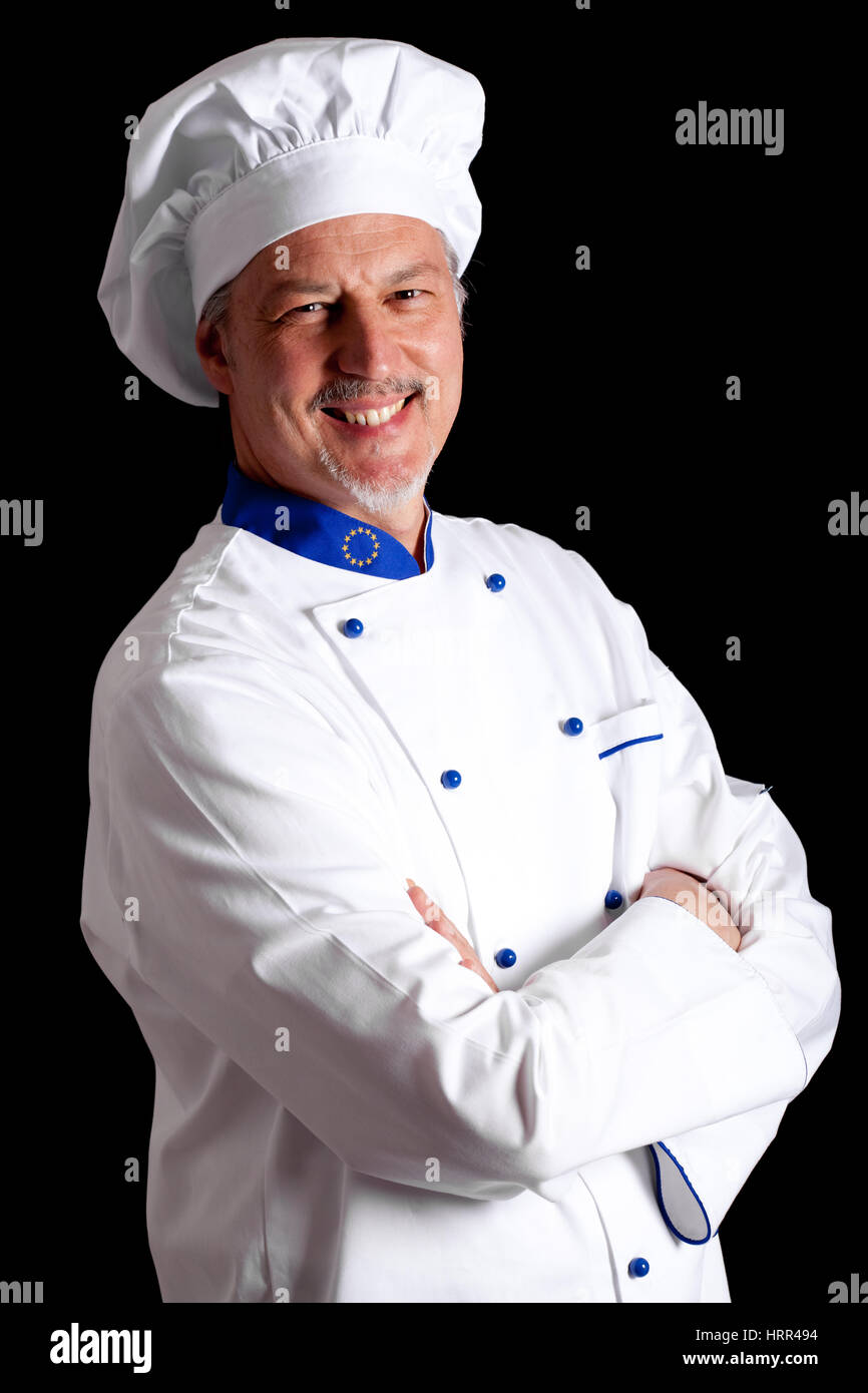 Portrait of an handsome chef isolated on black Stock Photo - Alamy