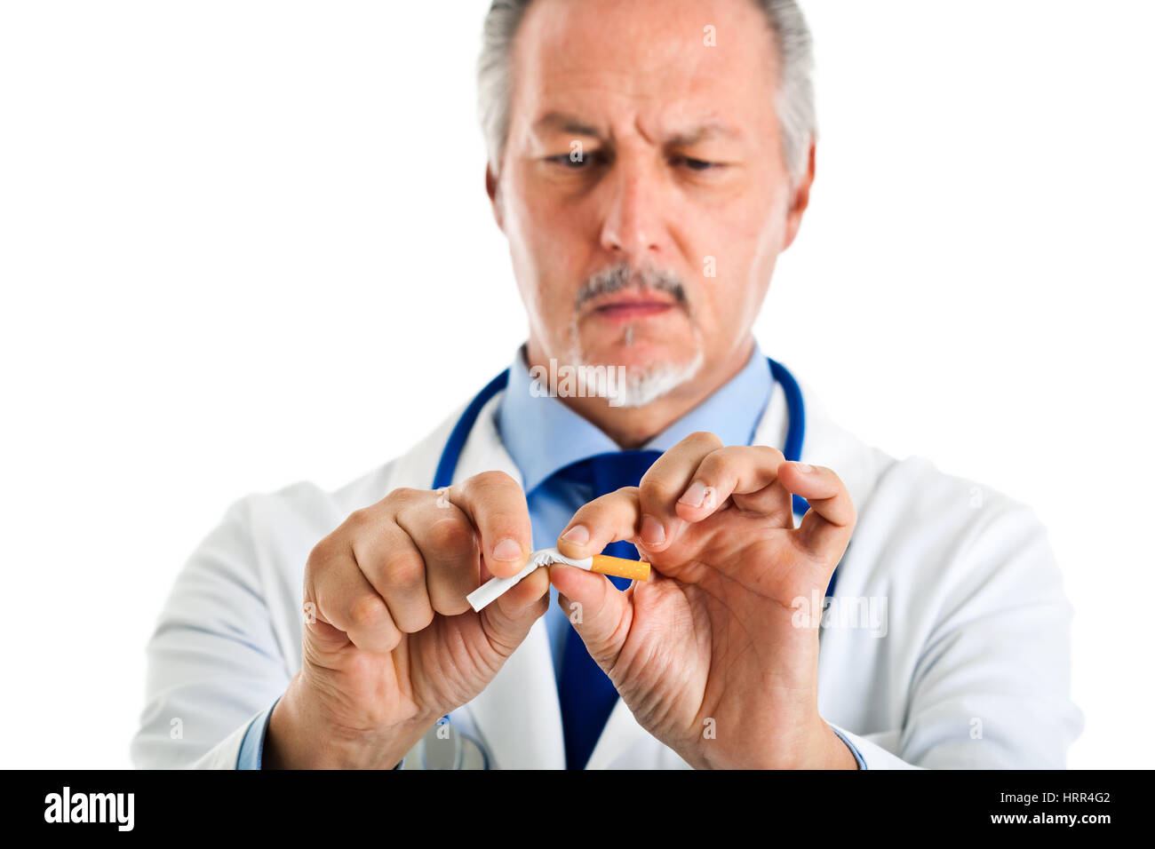 Closeup of a doctor's hands breaking a cigarette Stock Photo - Alamy
