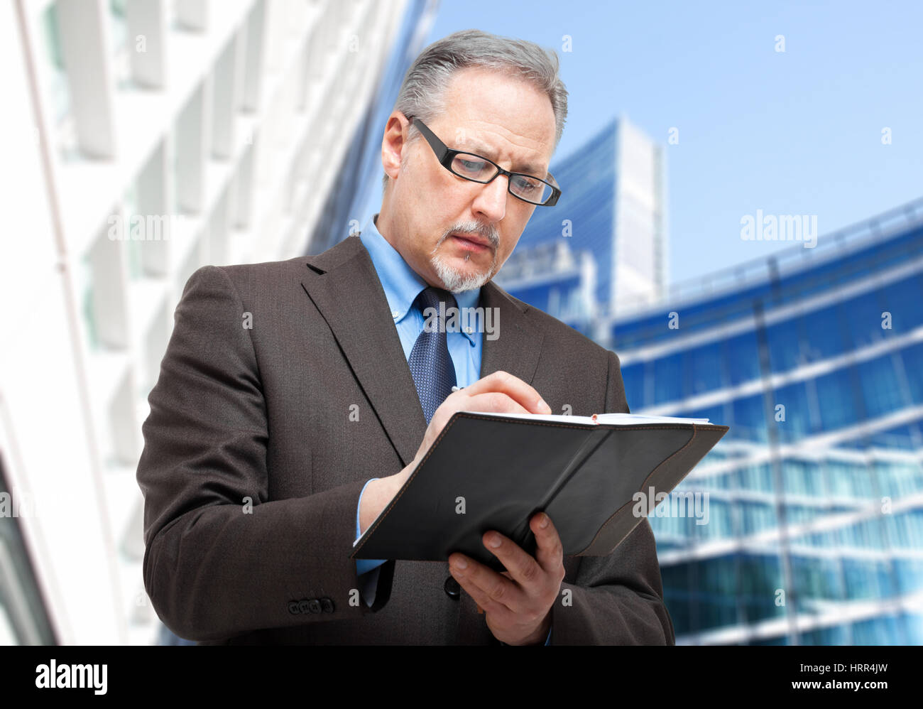 Employee taking notes on work hi-res stock photography and images - Alamy