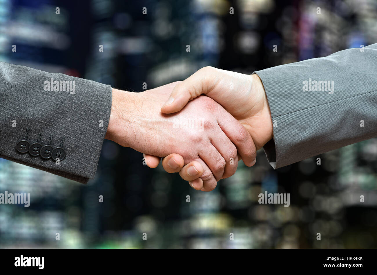 Handshake between business men Stock Photo - Alamy