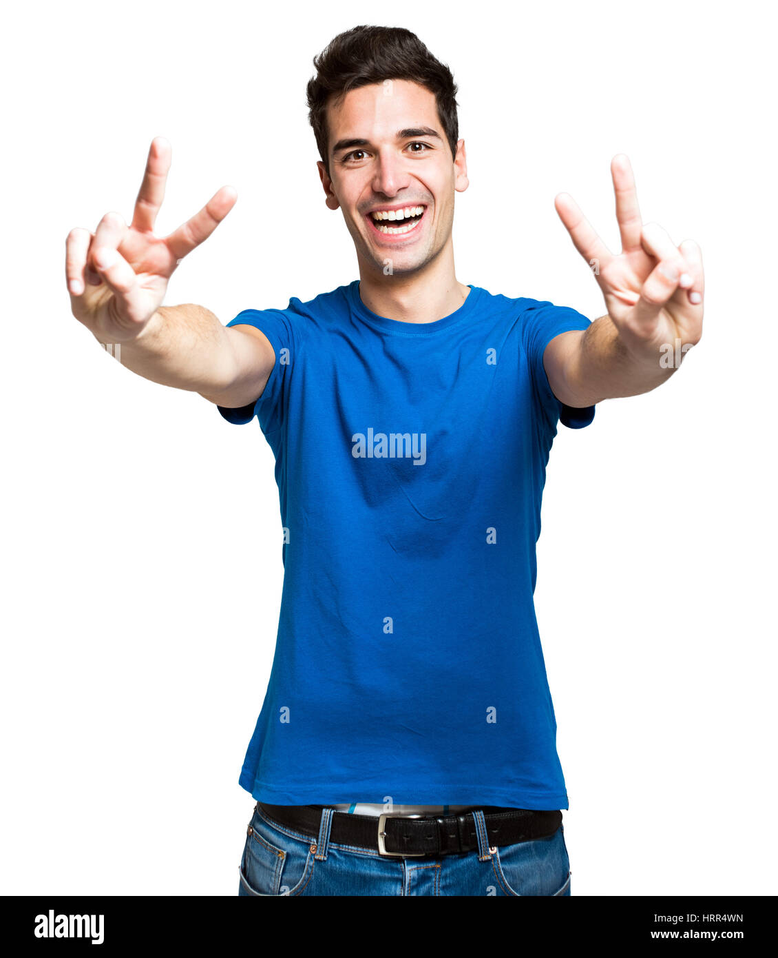 Handsome young man doing the victory sign Stock Photo - Alamy