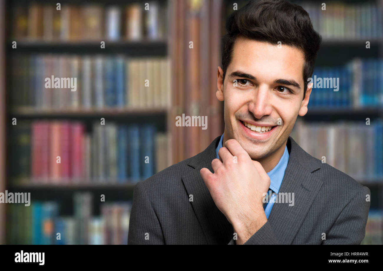 Portrait of a confident man smiling in his office Stock Photo - Alamy