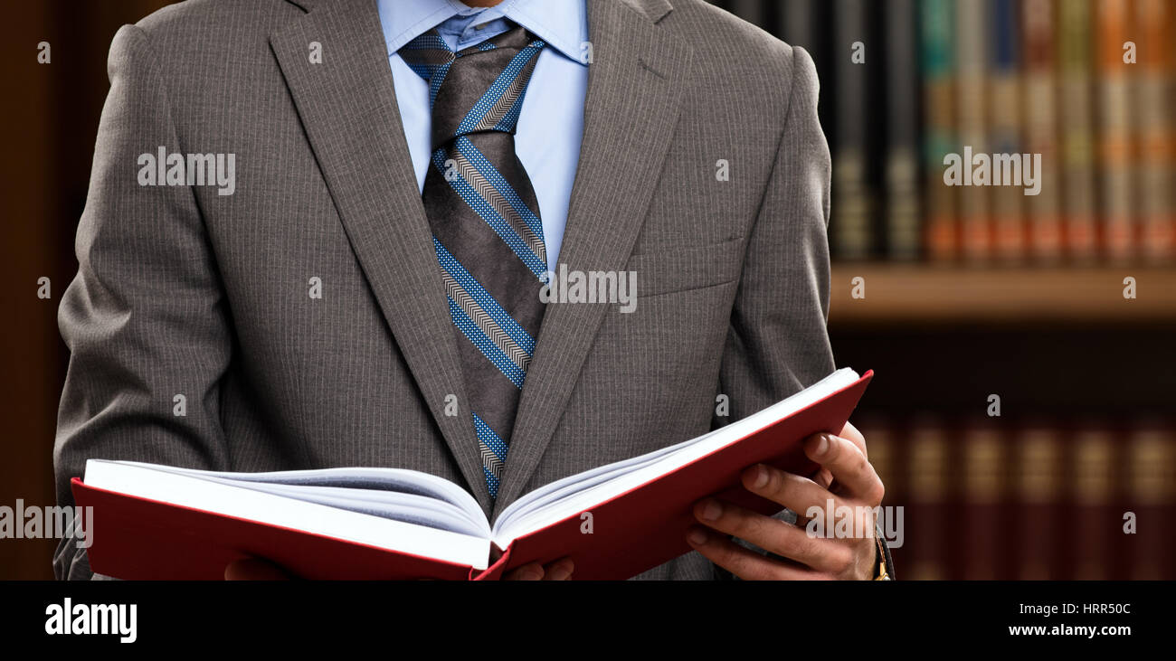 Lawyer reading a book Stock Photo - Alamy