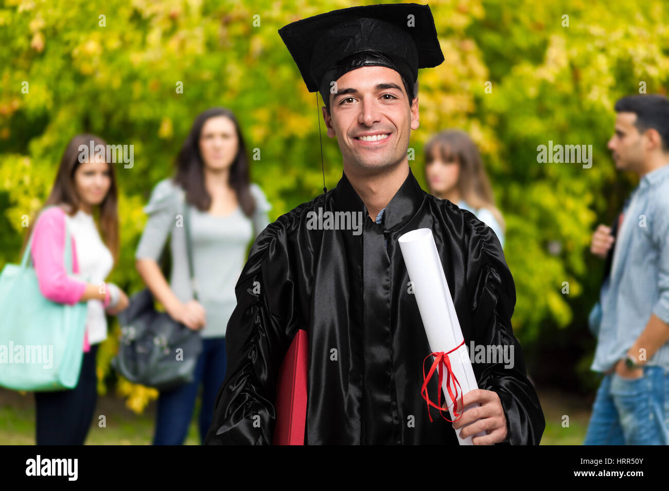 Portrait of happy graduating student Stock Photo - Alamy