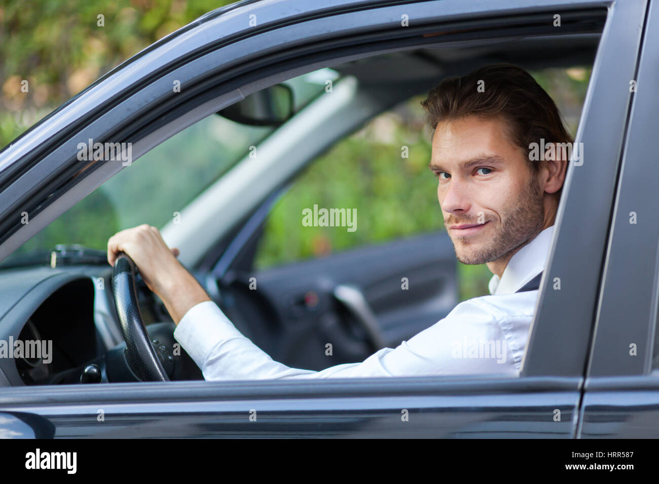 Portrait of a man driving his car Stock Photo - Alamy