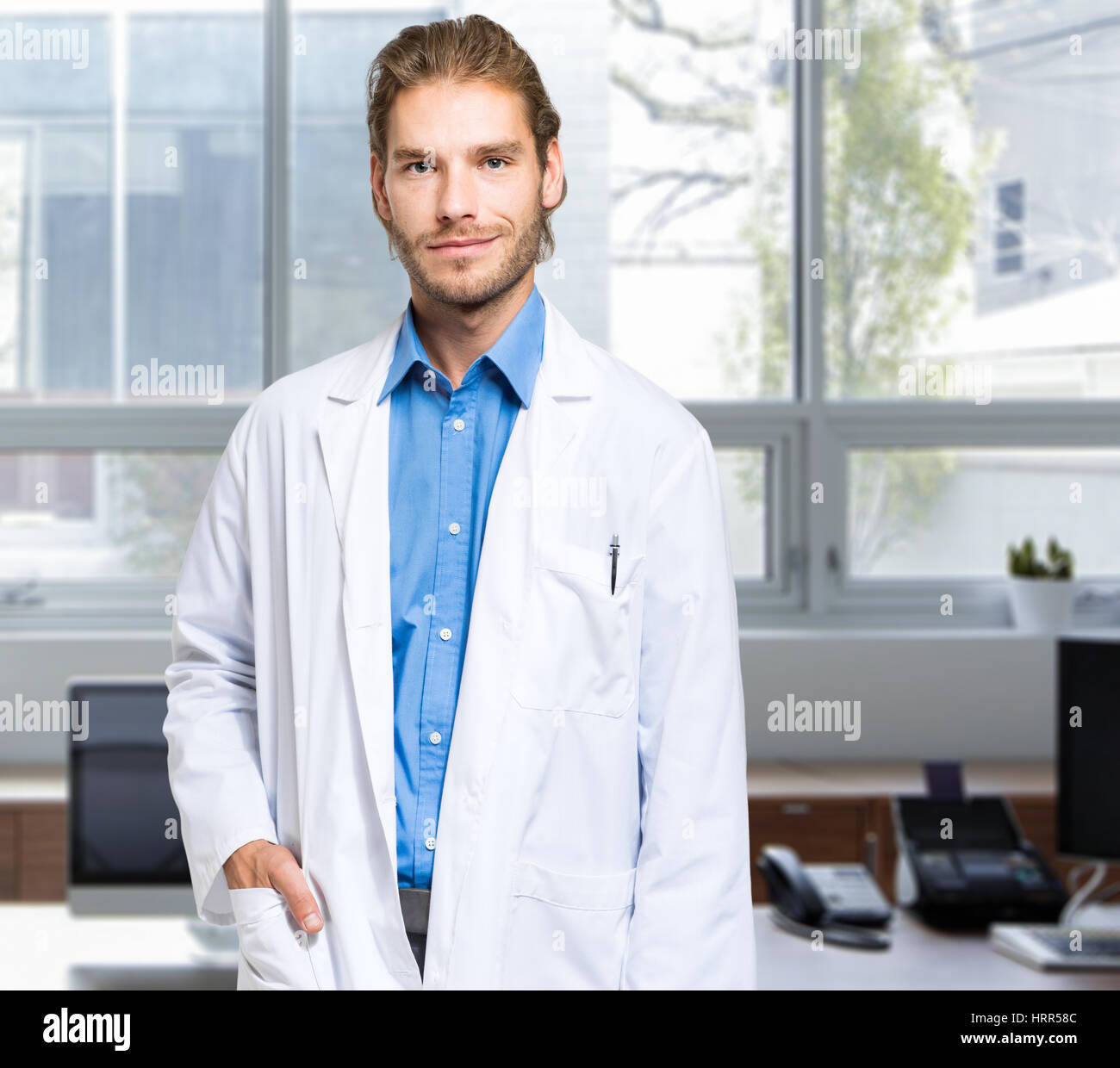Portrait of a handsome doctor Stock Photo - Alamy