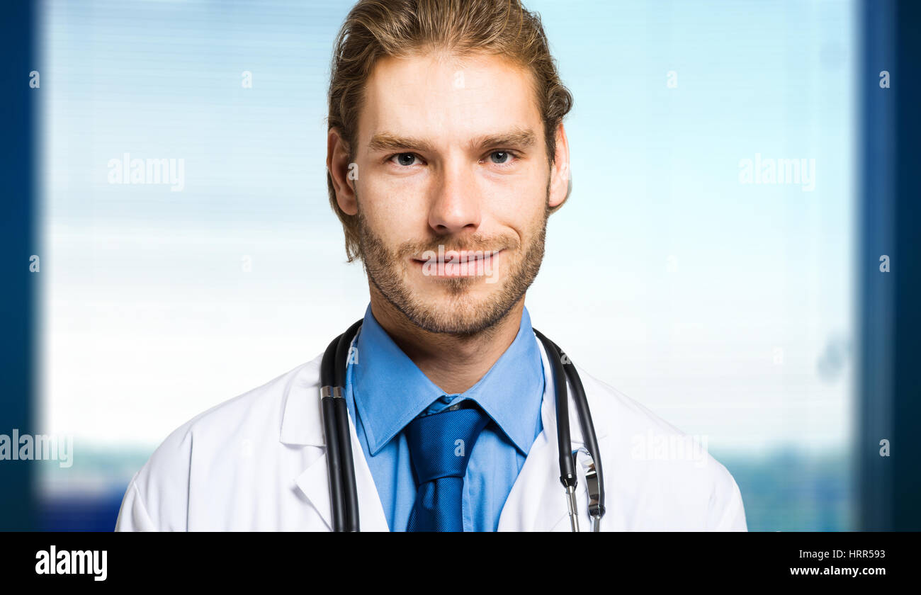 Portrait of a handsome doctor Stock Photo - Alamy