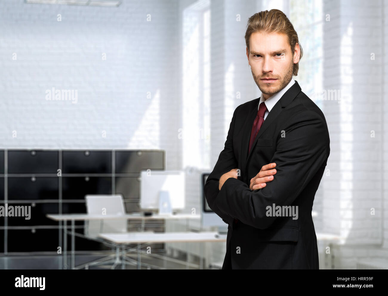 Portrait of a friendly businessman in his office Stock Photo - Alamy