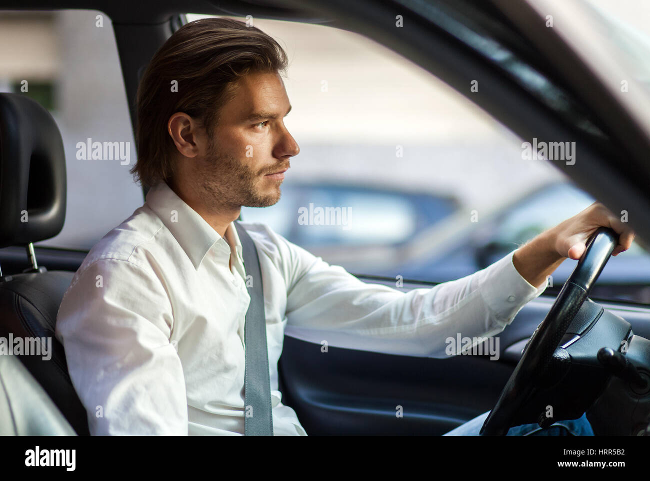Portrait of a man driving his car Stock Photo - Alamy