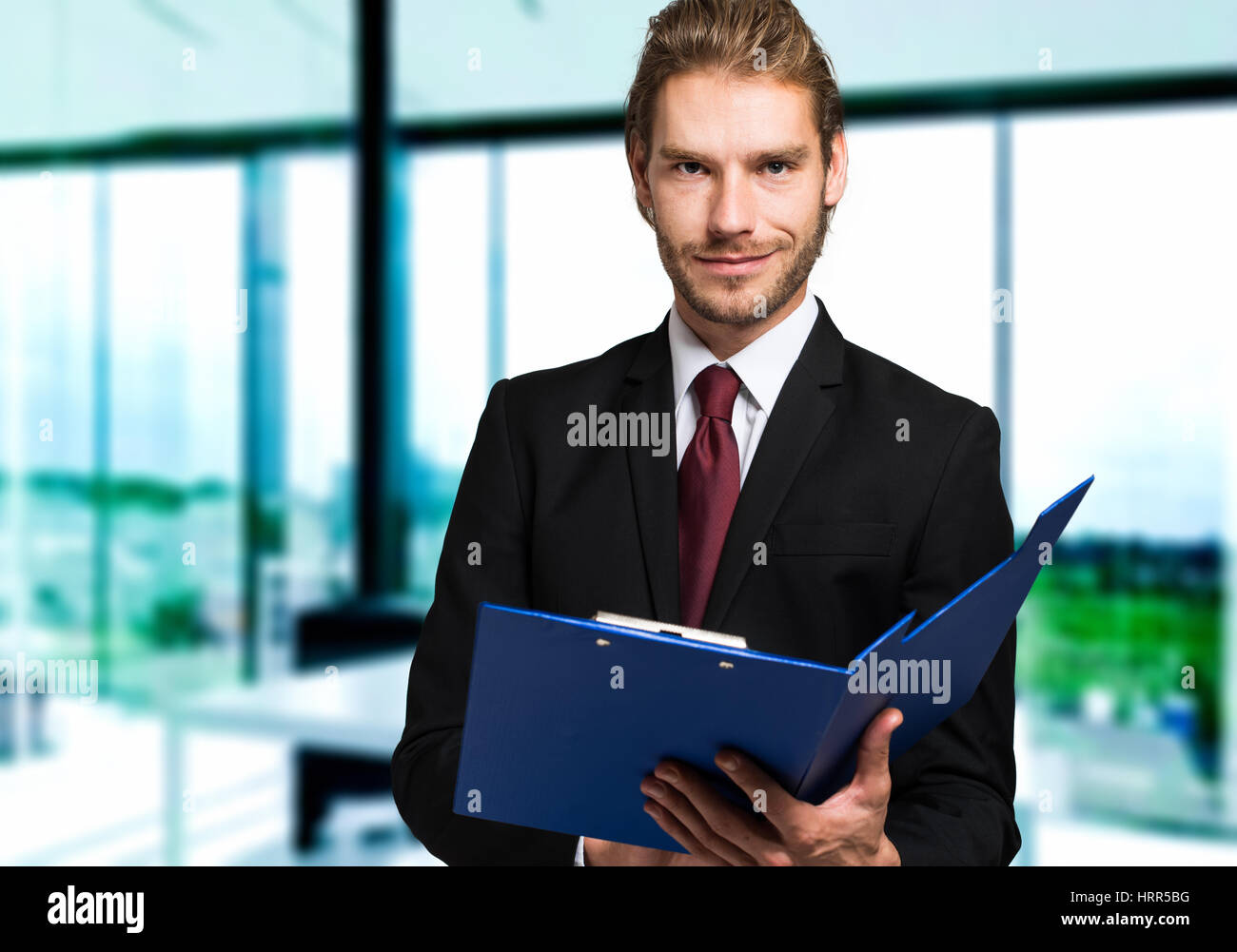 Handsome blond male manager portrait Stock Photo - Alamy