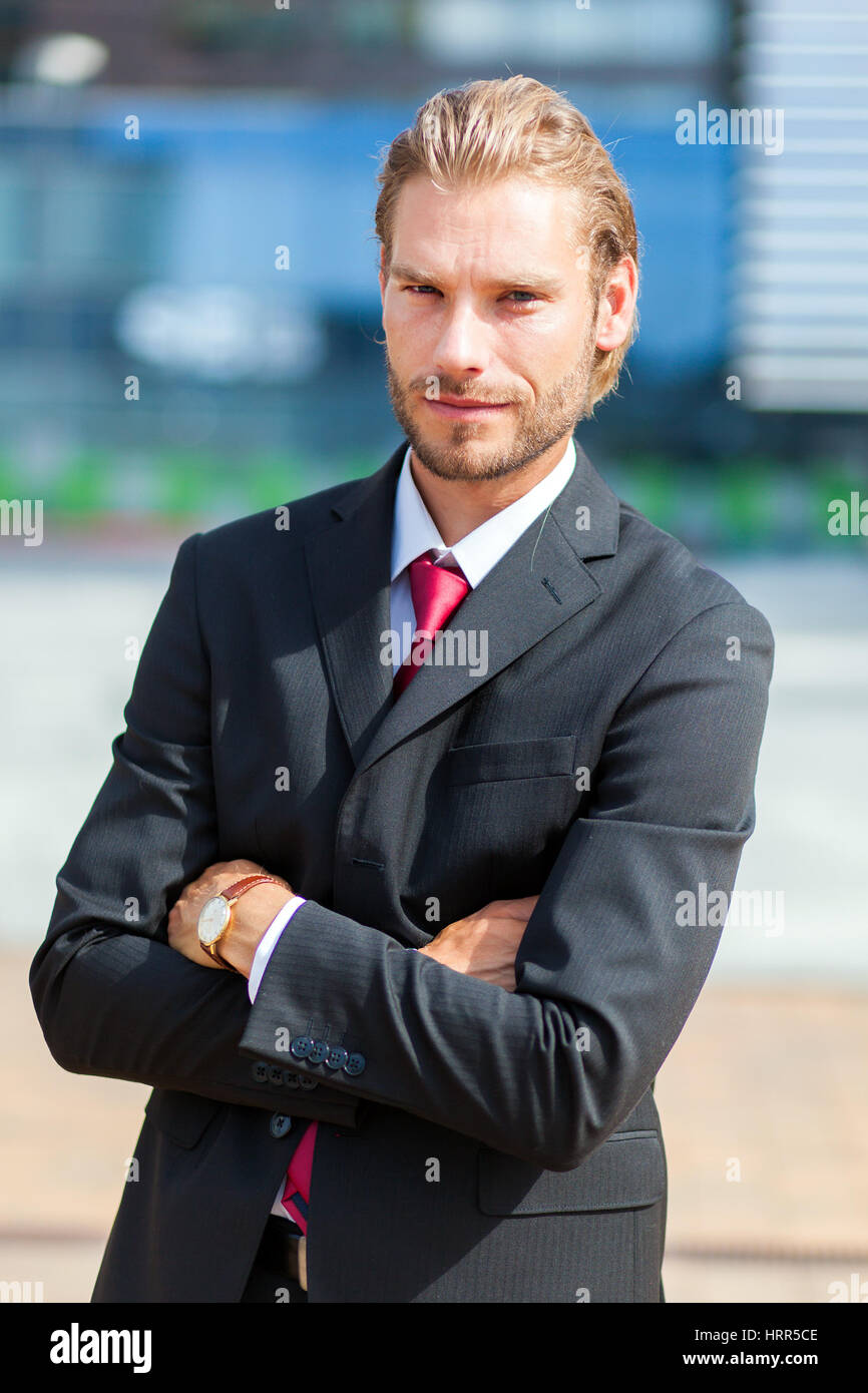 Handsome blonde male manager outdoor Stock Photo - Alamy