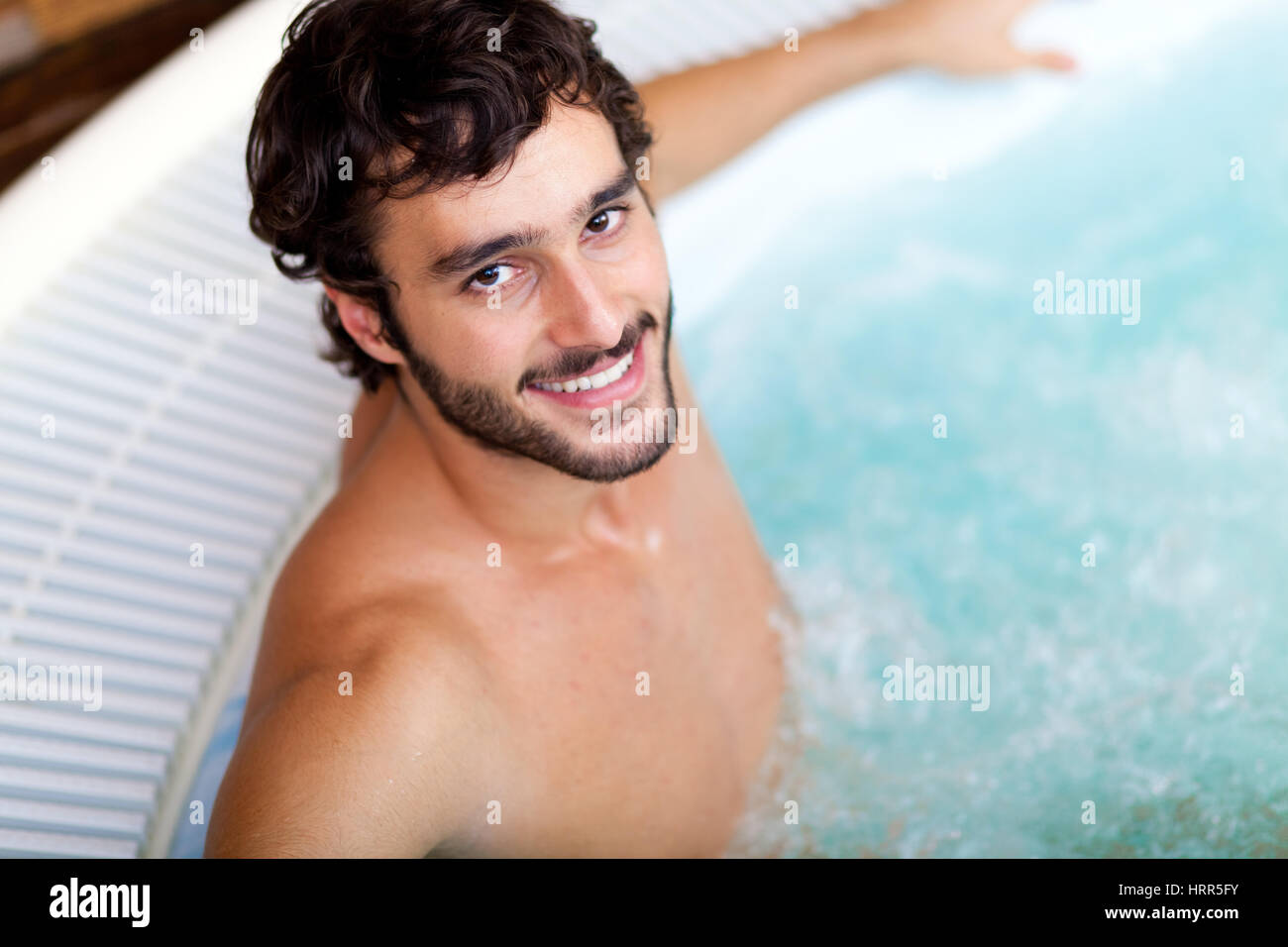 Man relaxing in a wellness center Stock Photo - Alamy