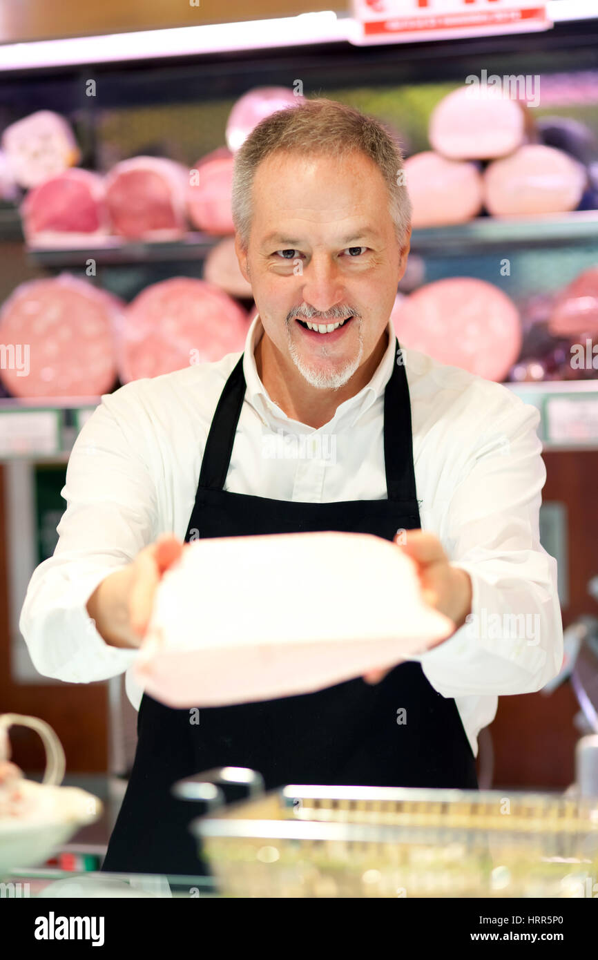 Shopkeeper working in his grocery store Stock Photo - Alamy