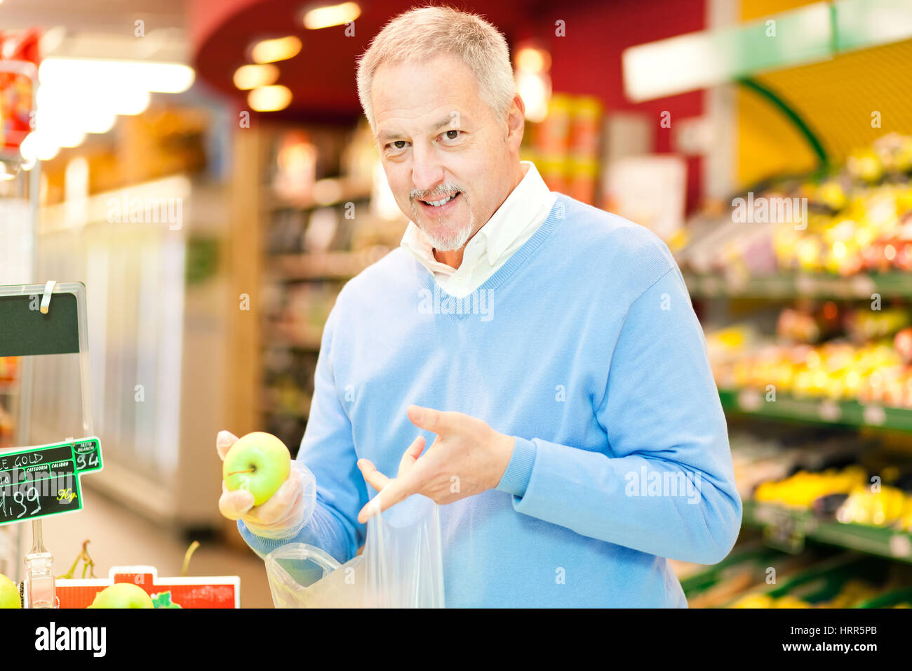Man shopping in a supermarket Stock Photo - Alamy
