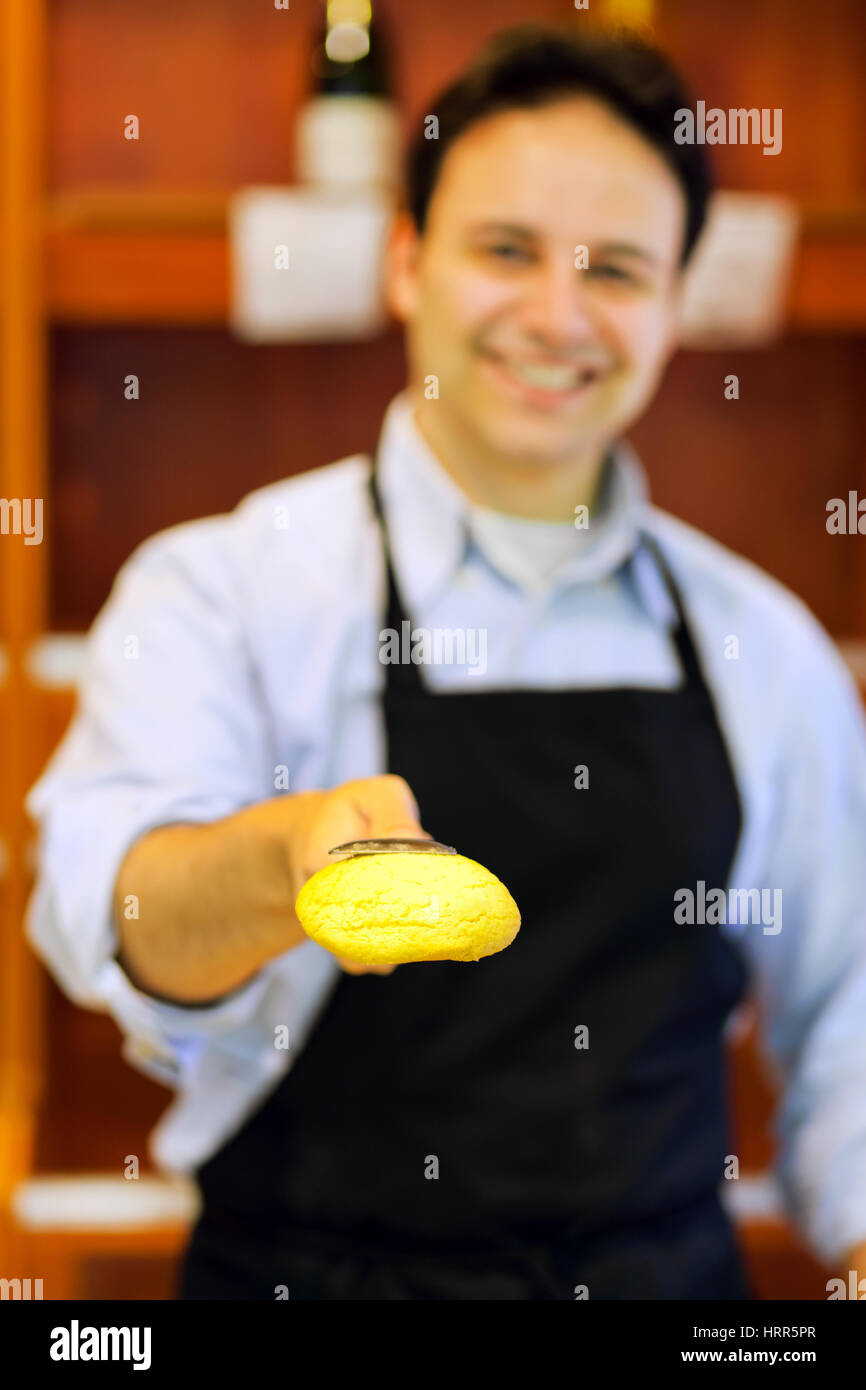 Shopkeeper serving a customer in a grocery store Stock Photo - Alamy