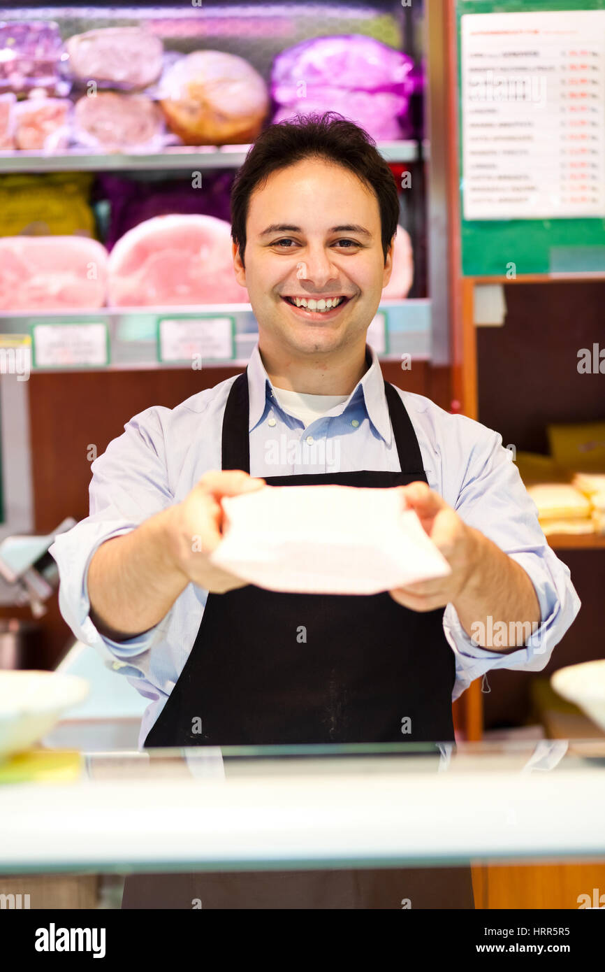 Shopkeeper working in his grocery store Stock Photo - Alamy