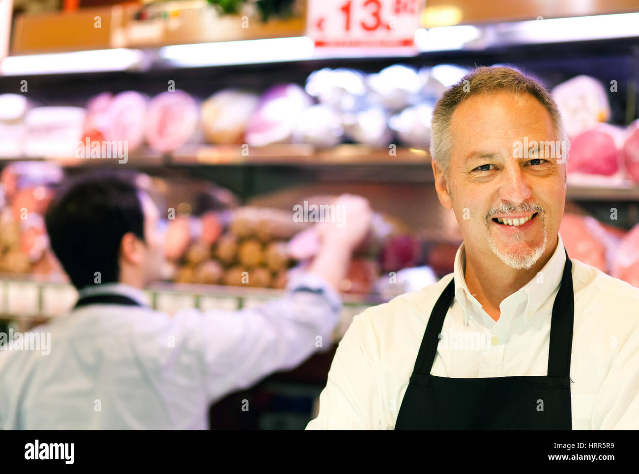 Shopkeeper working in his grocery store Stock Photo - Alamy