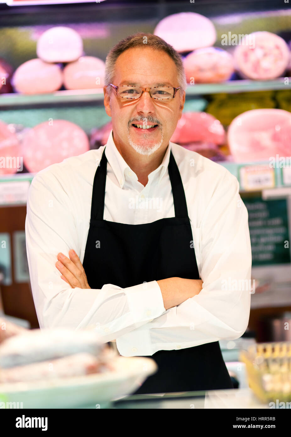 Shopkeeper working in his grocery store Stock Photo - Alamy