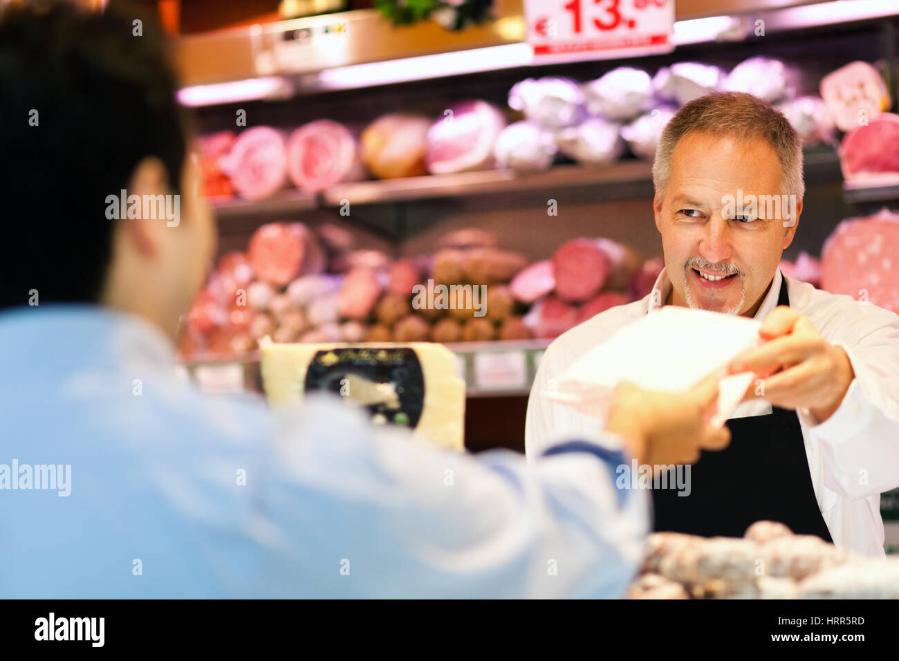 Butcher serving customer hi-res stock photography and images - Alamy