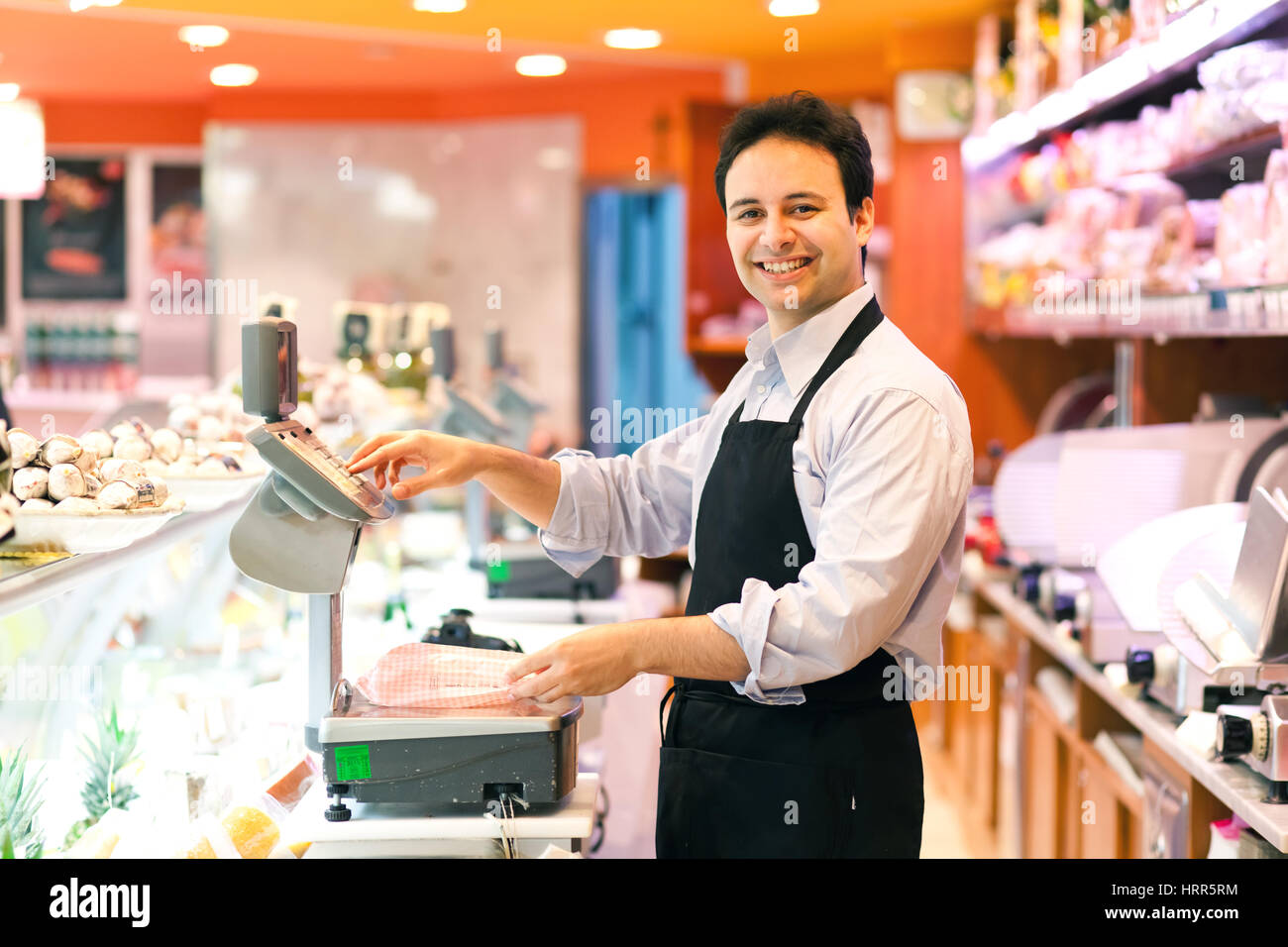 Shopkeeper working in his grocery store Stock Photo - Alamy